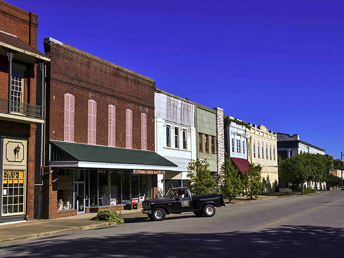 Downtown Demopolis showcases a rainbow of historic storefronts where time slows down and vintage trucks aren't ironic statements—they're Tuesday transportation.