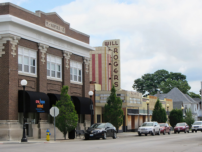 The historic Will Rogers Theatre stands as Charleston's art deco crown jewel, its vertical marquee a beacon of small-town charm and nostalgia.