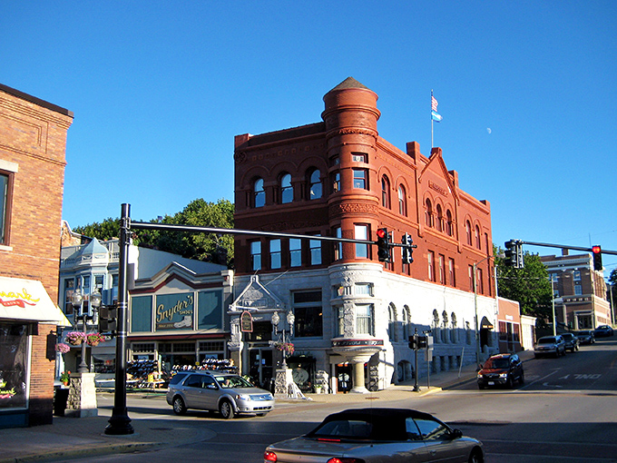 Downtown Manistee&rsquo;s striking red-brick landmark and vintage storefronts tell stories of a bygone era, where Victorian elegance meets small-town Michigan charm.