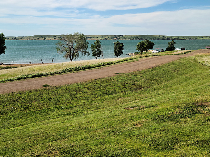 Where Kansas keeps its secret ocean. The shimmering waters of Wilson Reservoir stretch to the horizon, proving the Sunflower State isn't all cornfields after all.