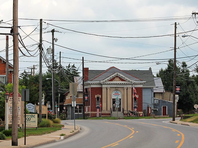 The heart of town welcomes visitors with classic American architecture. This red brick building stands as a testament to the area's rich heritage and community pride.