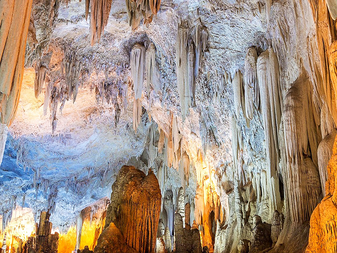 Nature's own light show illuminates these ancient formations, creating a subterranean cathedral that makes your average mansion look like amateur hour.