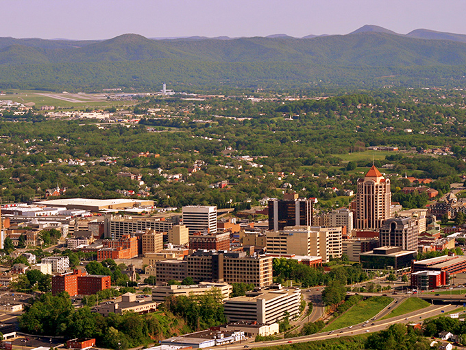 Roanoke's skyline nestled in the Blue Ridge Mountains offers that rare urban-meets-nature vibe that makes you wonder why you're paying big city rent.