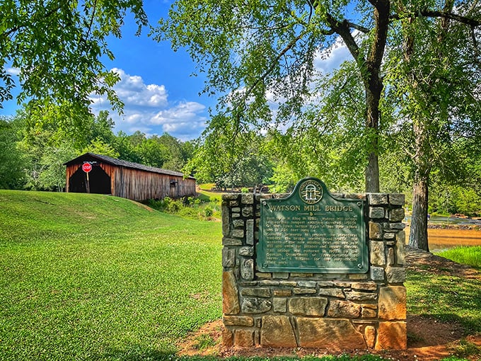 That covered bridge standing tall against Georgia skies isn't just photogenic&mdash;it's been earning its keep since the 1880s.