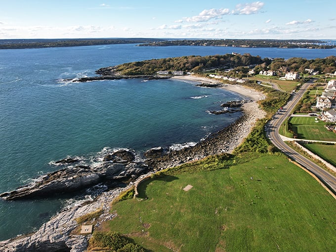 Where land meets sea in spectacular fashion. This aerial view of Brenton Point showcases Rhode Island's coastal splendor at its most breathtaking.
