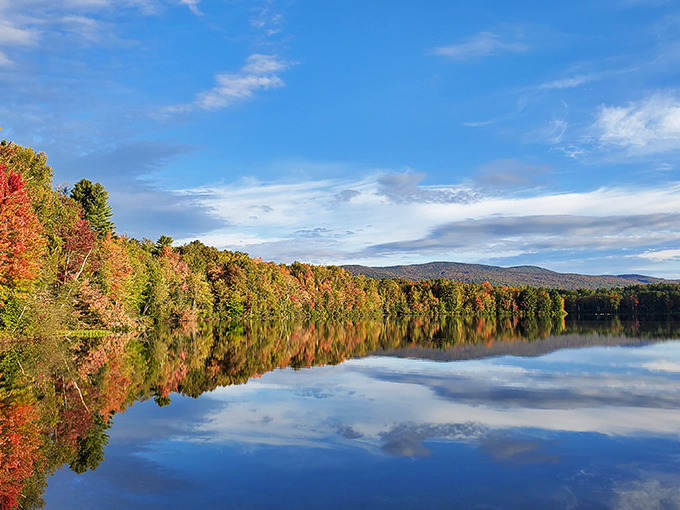 Nature's mirror game is undefeated here, where fall foliage creates a double feature of brilliance that no IMAX could ever match.