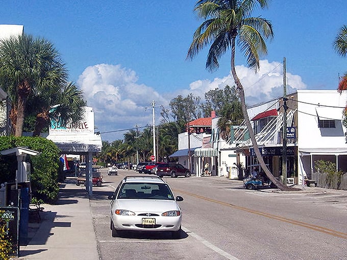Downtown Boca Grande welcomes you with palm trees and old Florida charm. This corner spot perfectly captures the island's unhurried elegance.