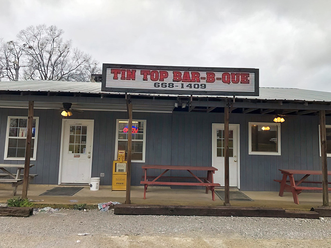 That iconic red sign against the blue siding is like a beacon of barbecue hope on County Road 33. No frills, just thrills for your taste buds.