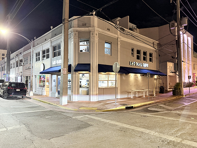 Las Olas Cafe stands proudly on its corner in Miami Beach, its blue awnings like beacons guiding hungry souls to Cuban breakfast paradise.