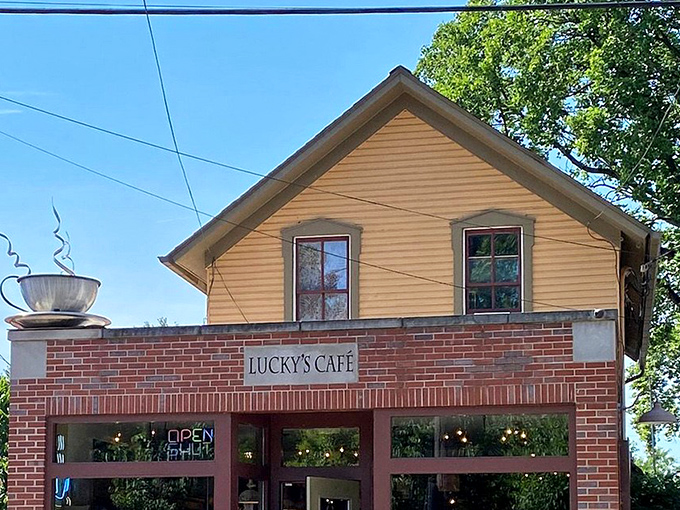 The charming yellow and brick exterior of Lucky's Cafe stands like a beacon of breakfast hope in Cleveland's Tremont neighborhood.