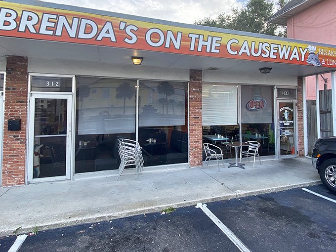 The bright sign beckons like a lighthouse for the breakfast-starved. No fancy frills here, just the promise of honest-to-goodness morning salvation.