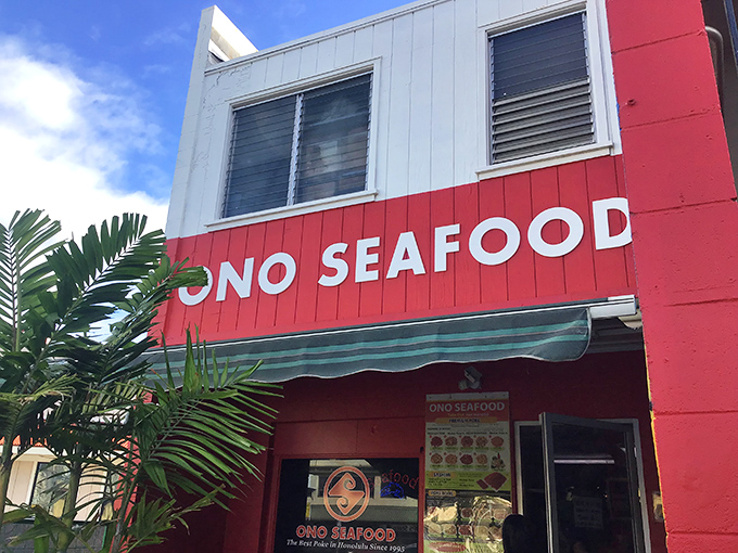 The bright red exterior of Ono Seafood stands like a beacon of deliciousness on Kapahulu Avenue. Sometimes the most unassuming buildings hide the greatest culinary treasures.