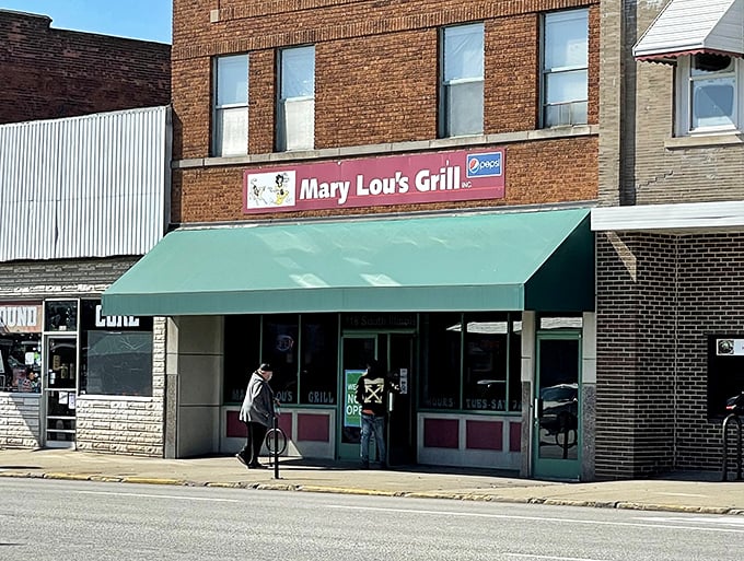 The unassuming brick exterior with its modest green awning hides culinary treasures that have kept locals coming back for generations.