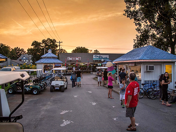 Sunset paints the sky golden over Kelleys Island's downtown hub, where golf carts rule the roads and island time officially begins.