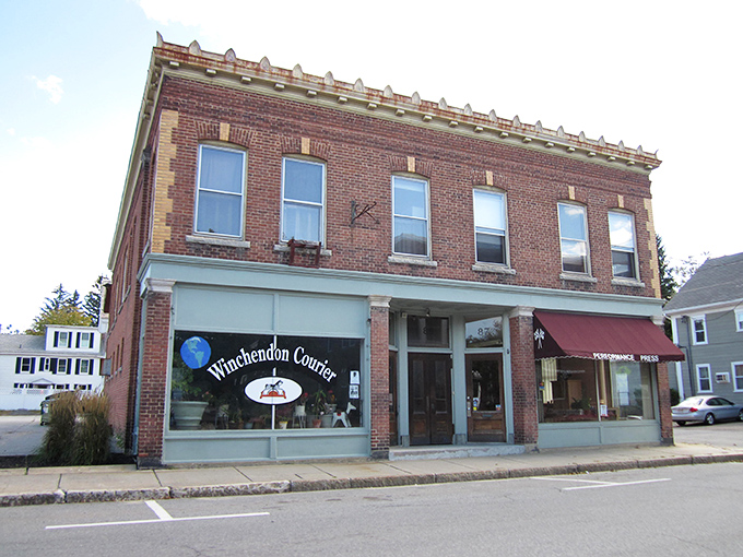 Historic brick buildings like the Winchendon Courier office stand as charming sentinels of small-town life, where news travels at the perfect unhurried pace.