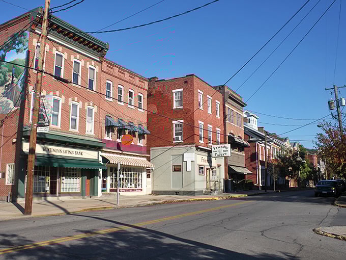 Those red brick beauties aren't just buildings &ndash; they're time machines disguised as storefronts, waiting to transport you back to simpler days.