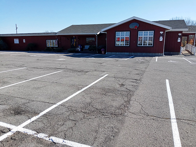 A classic roadside BBQ joint that doesn't need fancy frills—just the promise of spectacular ribs waiting inside those barn-red walls.
