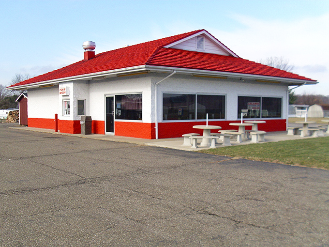 The iconic red-roofed sanctuary of smoke and flavor stands unassumingly along the roadside, promising barbecue salvation to those wise enough to stop.