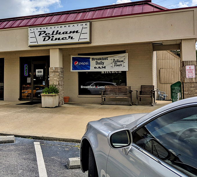 The unassuming storefront of Pelham Diner beckons with its burgundy awning and simple signage&mdash;proof that culinary treasures often hide in plain sight.
