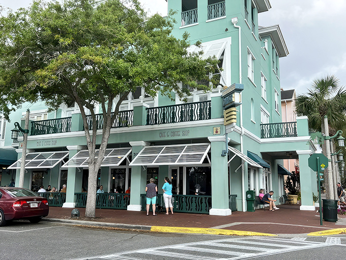 The mint-green facade of Downtown Diner stands out in Celebration like a beacon of comfort food promise, beckoning hungry visitors with its charming architecture.