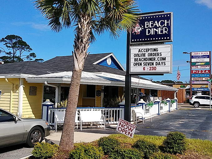 The cheerful yellow exterior of Beach Diner stands like a breakfast lighthouse, beckoning hungry travelers with its no-nonsense sign and promise of morning salvation.