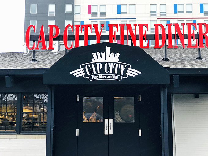 The bold red letters of Cap City Fine Diner beckon like a lighthouse for the hungry, promising comfort food with an upscale twist in Columbus.
