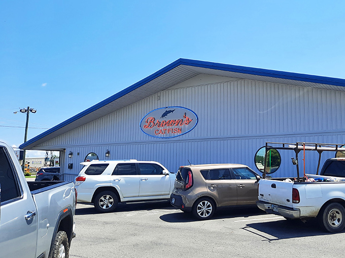 The white building with blue trim stands like a beacon of hope for hungry travelers&mdash;a cathedral of catfish where pilgrims of the palate find salvation in seafood.