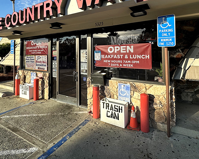 The unassuming exterior of Country Way beckons like an old friend, promising comfort food treasures behind that stone facade and no-nonsense signage.