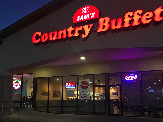 Sam's iconic red signage glows like a beacon in the night, promising comfort food salvation to hungry Tallahassee travelers. The universal language of "OPEN" needs no translation.