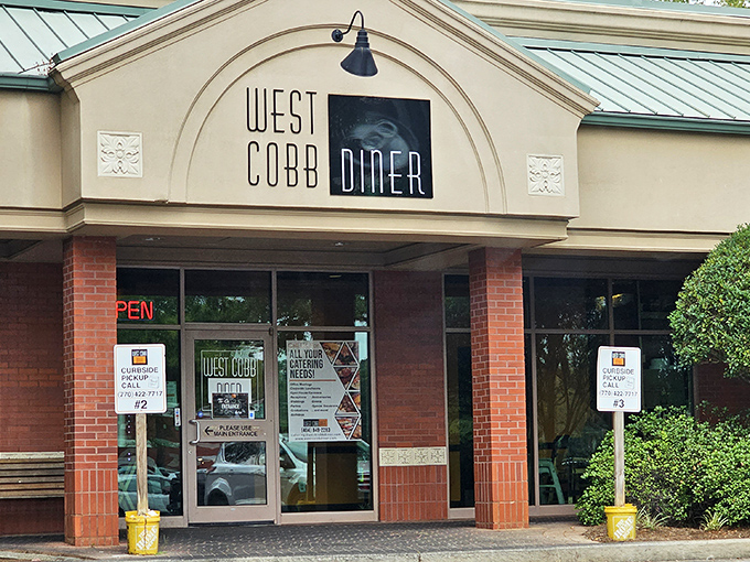 The unassuming storefront of West Cobb Diner hides culinary treasures within, proving that books and restaurants should never be judged by their covers.