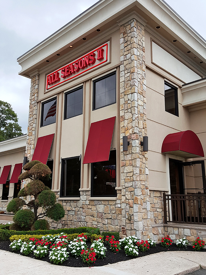 The stone facade and vibrant red awnings of All Seasons Diner II stand as a beacon of breakfast hope along Route 9. Classic Jersey diner architecture at its finest.