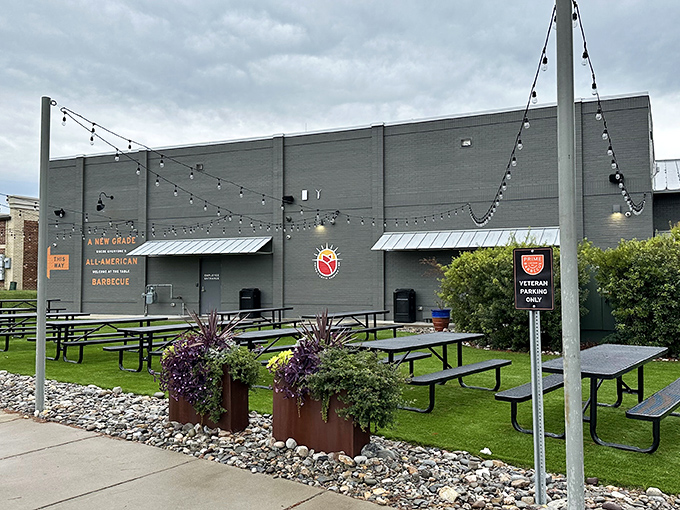 The modern exterior of Prime Barbecue stands like a beacon of hope for hungry travelers. That orange sign promises smoky salvation just beyond those doors.
