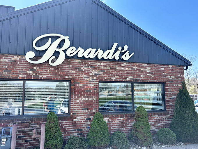 The classic brick-and-navy exterior of Berardi's stands as a beacon of culinary promise in Huron, where the elegant script signage has welcomed hungry patrons for decades.