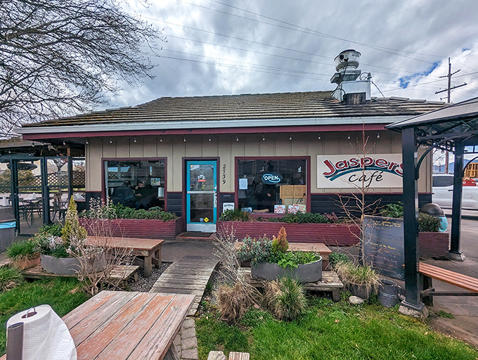 Jaspers' charming storefront welcomes hungry visitors with its colorful sign and inviting outdoor seating &ndash; burger paradise found!