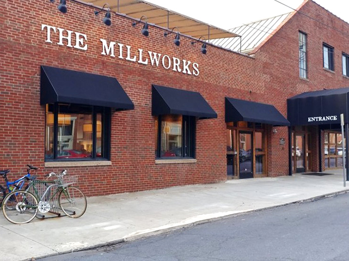 The brick facade of The Millworks stands like a culinary fortress in Harrisburg, promising delicious adventures within its historic walls.