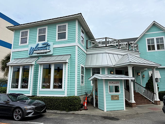 The distinctive aqua-blue exterior of Waterman's stands out like a beachside beacon, promising seafood treasures within its coastal-chic walls.