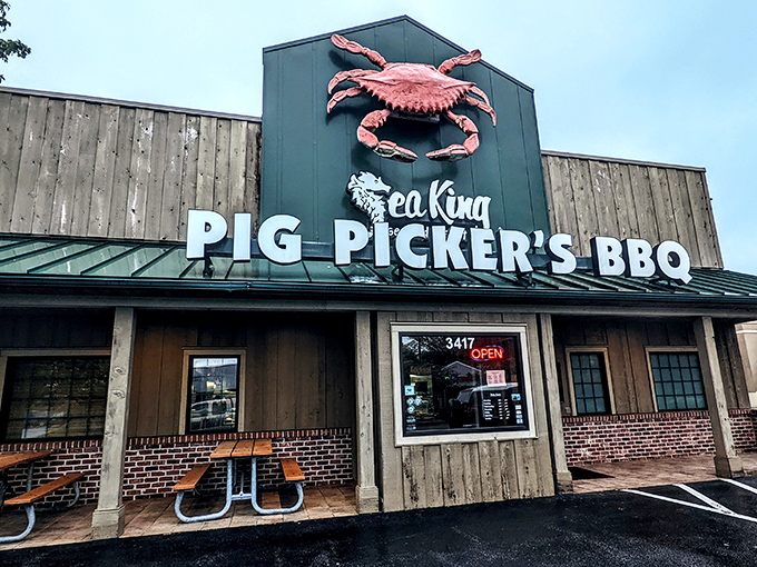 The giant red crab atop Sea King beckons like a crustacean lighthouse, promising treasures of the deep alongside smoky BBQ delights.