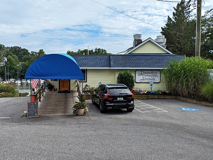 The unassuming yellow exterior of Donnelly's Dockside proves once again that Maryland's best seafood treasures often hide in plain sight. That blue awning practically whispers, "Come on in!"