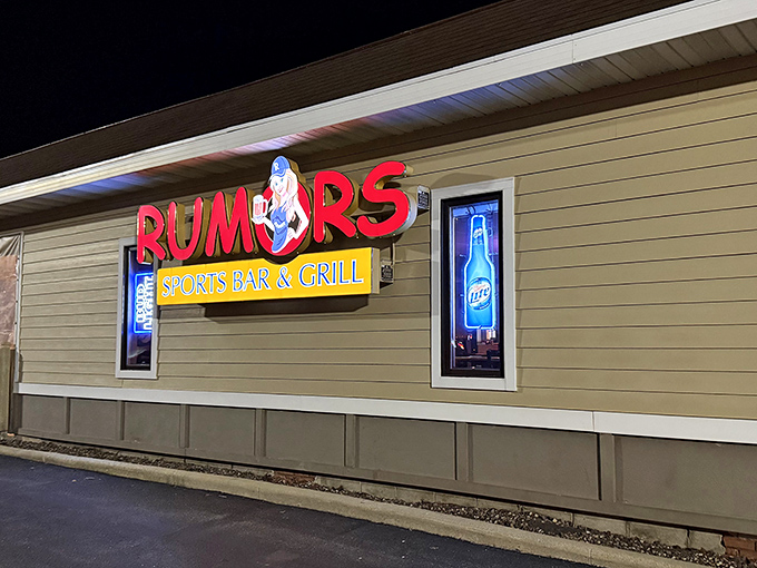 The neon glow of Rumors beckons like a lighthouse for hungry travelers. Wisconsin nights were made for places that promise both sports and sustenance.