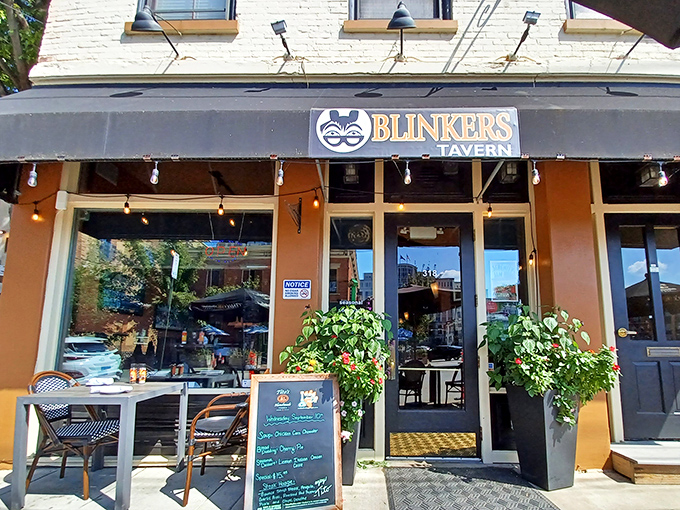 The inviting storefront features string lights and lush greenery, creating that "where everybody knows your name" vibe before you even step inside.