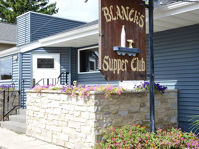 The rustic wooden sign at Blanck's Supper Club welcomes you like an old friend, promising comfort food and cocktails that could make a Monday feel like Saturday.