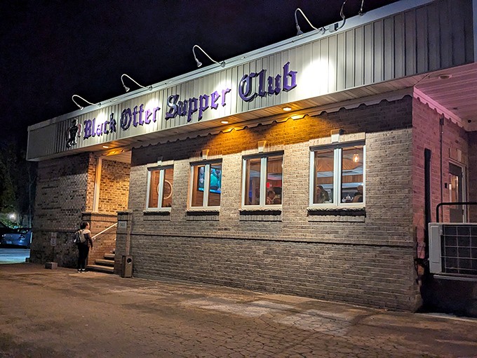 By night, the illuminated sign beckons hungry travelers like a lighthouse guiding ships to the shores of deliciousness.