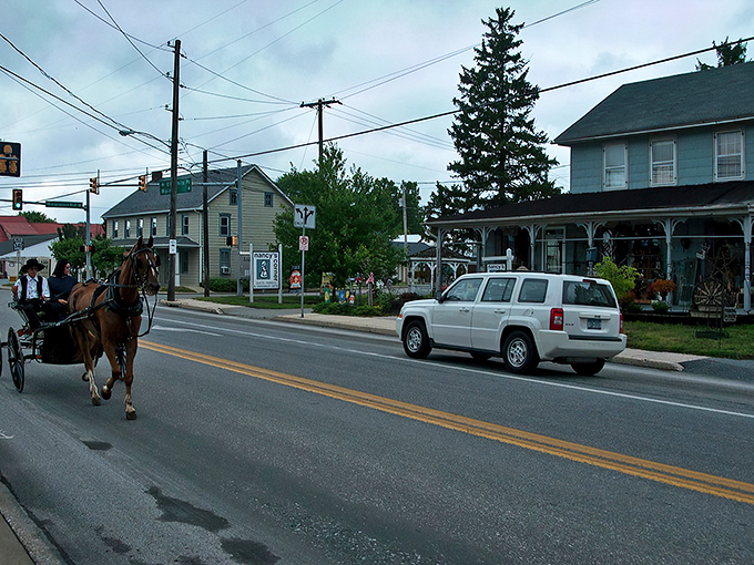 Whoa, look at this! A horse and buggy right alongside an SUV. That's Intercourse, Pennsylvania: old-school charm meets the modern road!