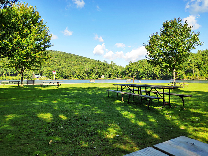 Echo Lake's pristine waters provide the perfect backdrop for an afternoon of relaxation. These picnic tables aren't just furniture&mdash;they're front-row seats to Vermont's natural theater.