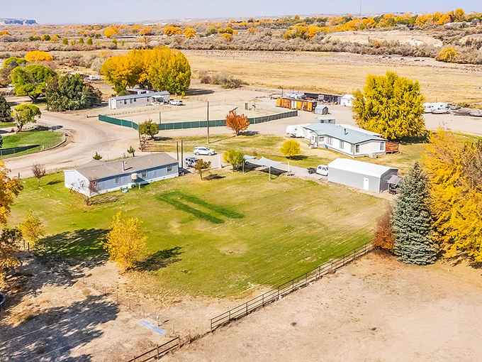 Autumn paints Bloomfield in gold and amber, where modest homes nestle against the backdrop of New Mexico's sweeping landscape. Nature's seasonal art show at its finest.