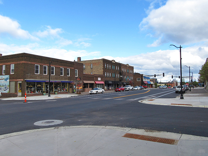 Historic charm meets small-town affordability on Cloquet's main street, where brick buildings whisper stories of generations who've called this riverside community home.