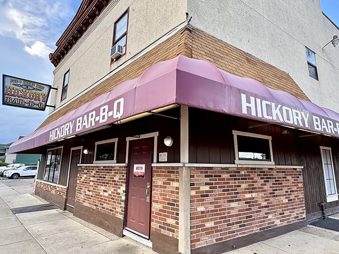 The burgundy awning of Hickory Bar-B-Q stands as a beacon of comfort food in Dayton, where unpretentious exteriors often hide culinary treasures.