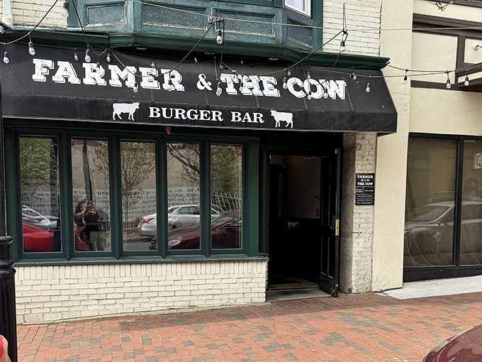 Green-trimmed windows and classic brick create that "you've just discovered something special" feeling before you even step inside.