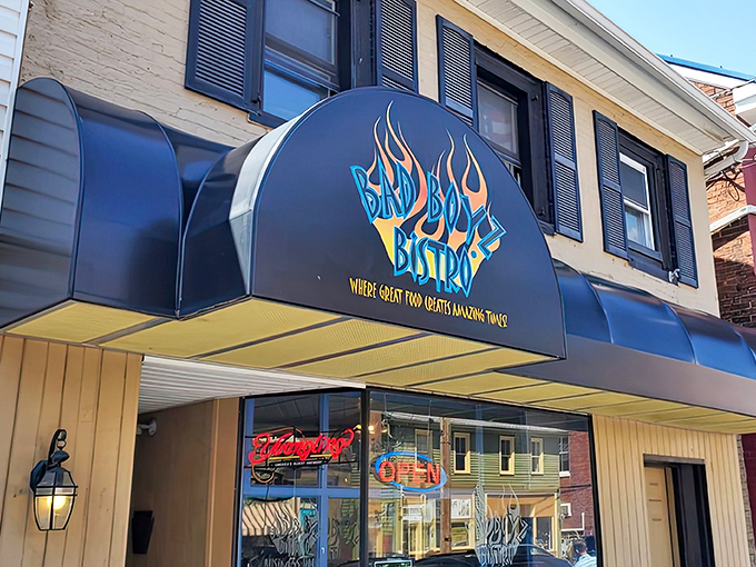 That black awning isn't just eye-catching by day&mdash;it transforms into a beacon of culinary hope for evening diners seeking serious comfort food satisfaction.