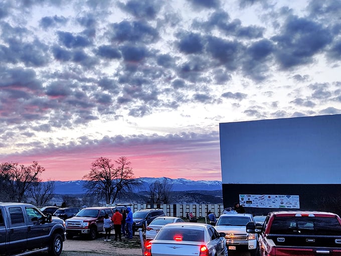 Mother Nature's pre-show spectacle outshines any Hollywood special effects as cars gather beneath a cotton candy sky. Pure Utah magic.